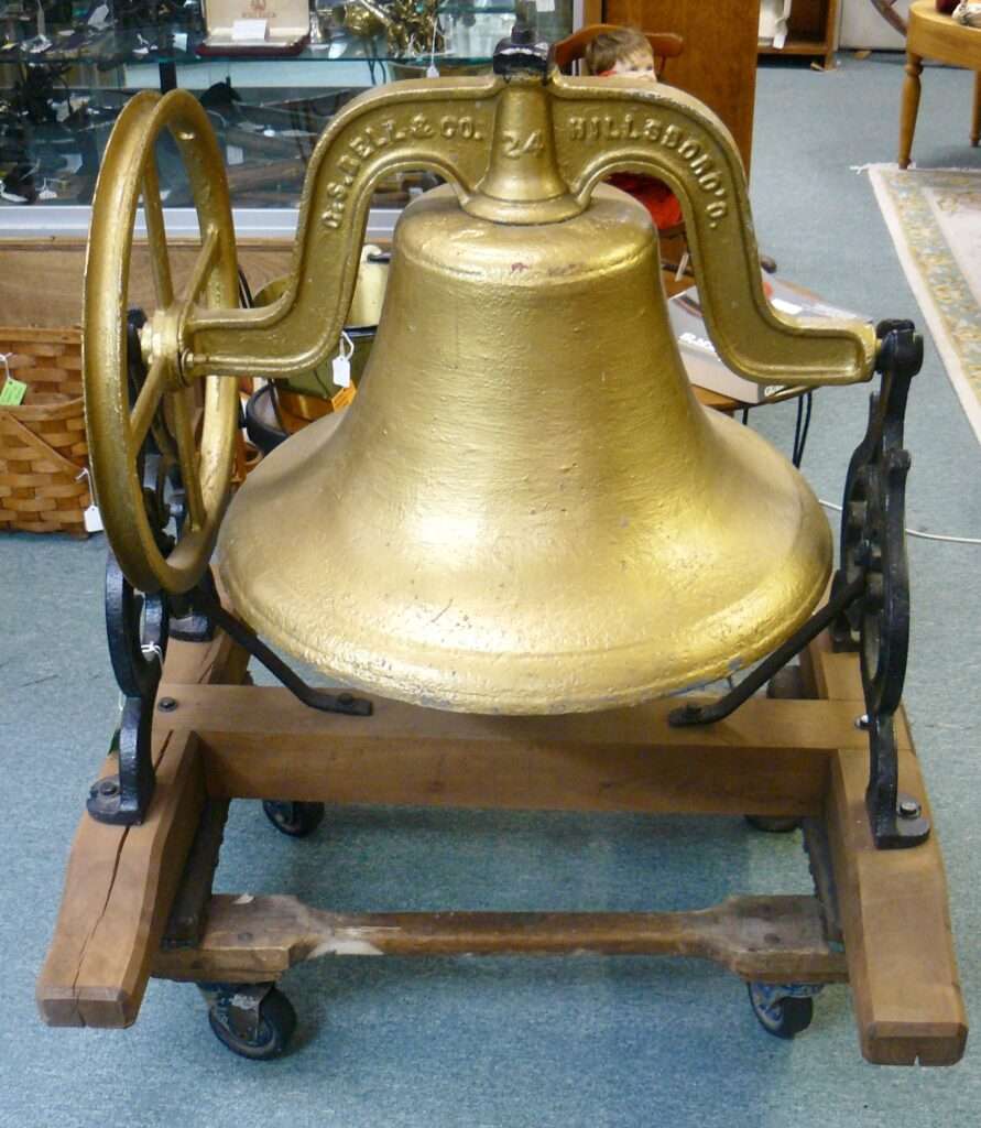 A Rope Pull Bell, An Arched Door Corner Cabinet and an Ornately Carved ...